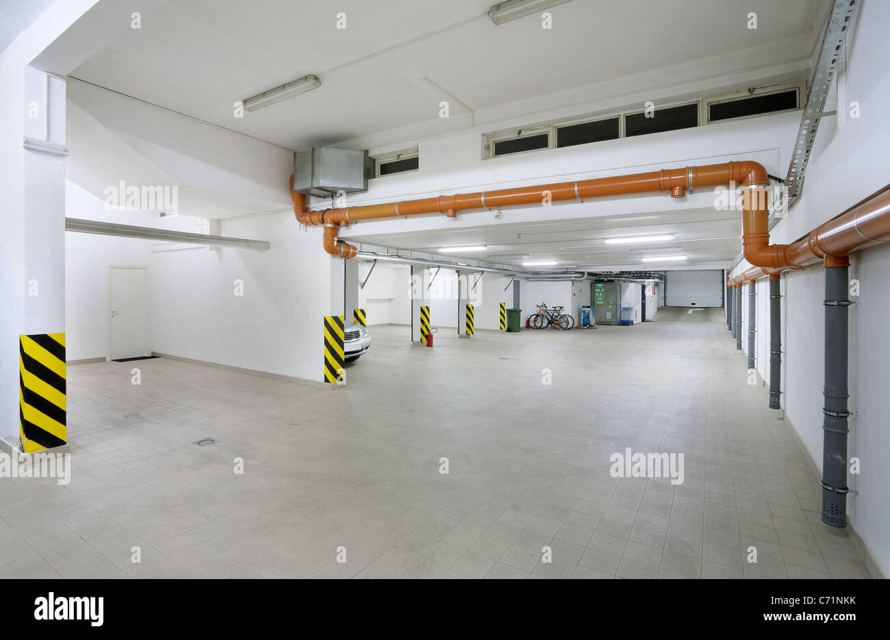 Interior of a hotel garage, simple, empty and white Stock Photo - Alamy