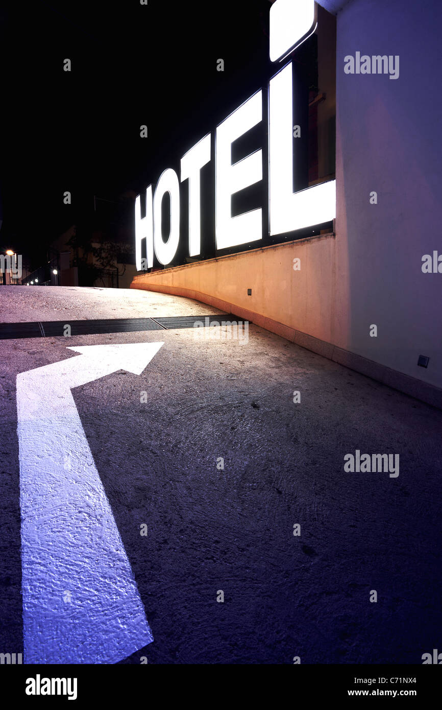 Entrance of a hotel, light letters Stock Photo - Alamy