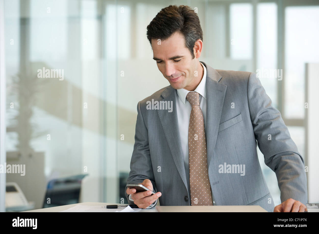 Executive text messaging, portrait Stock Photo - Alamy