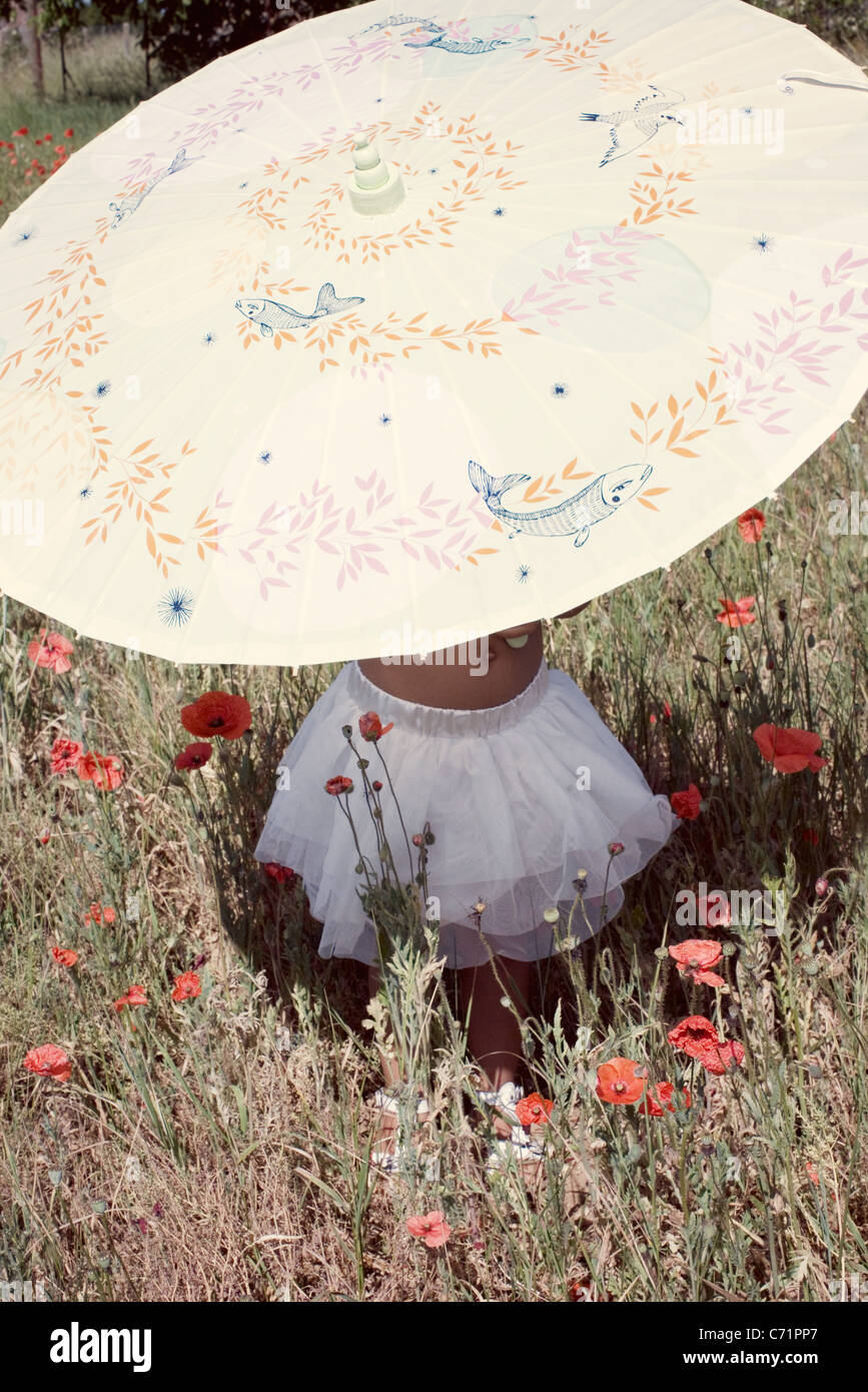 Little girl with parasol in meadow, mid section Stock Photo - Alamy
