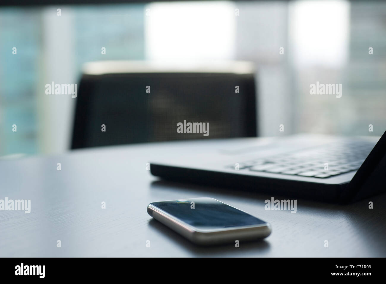 Cell phone and laptop computer Stock Photo - Alamy