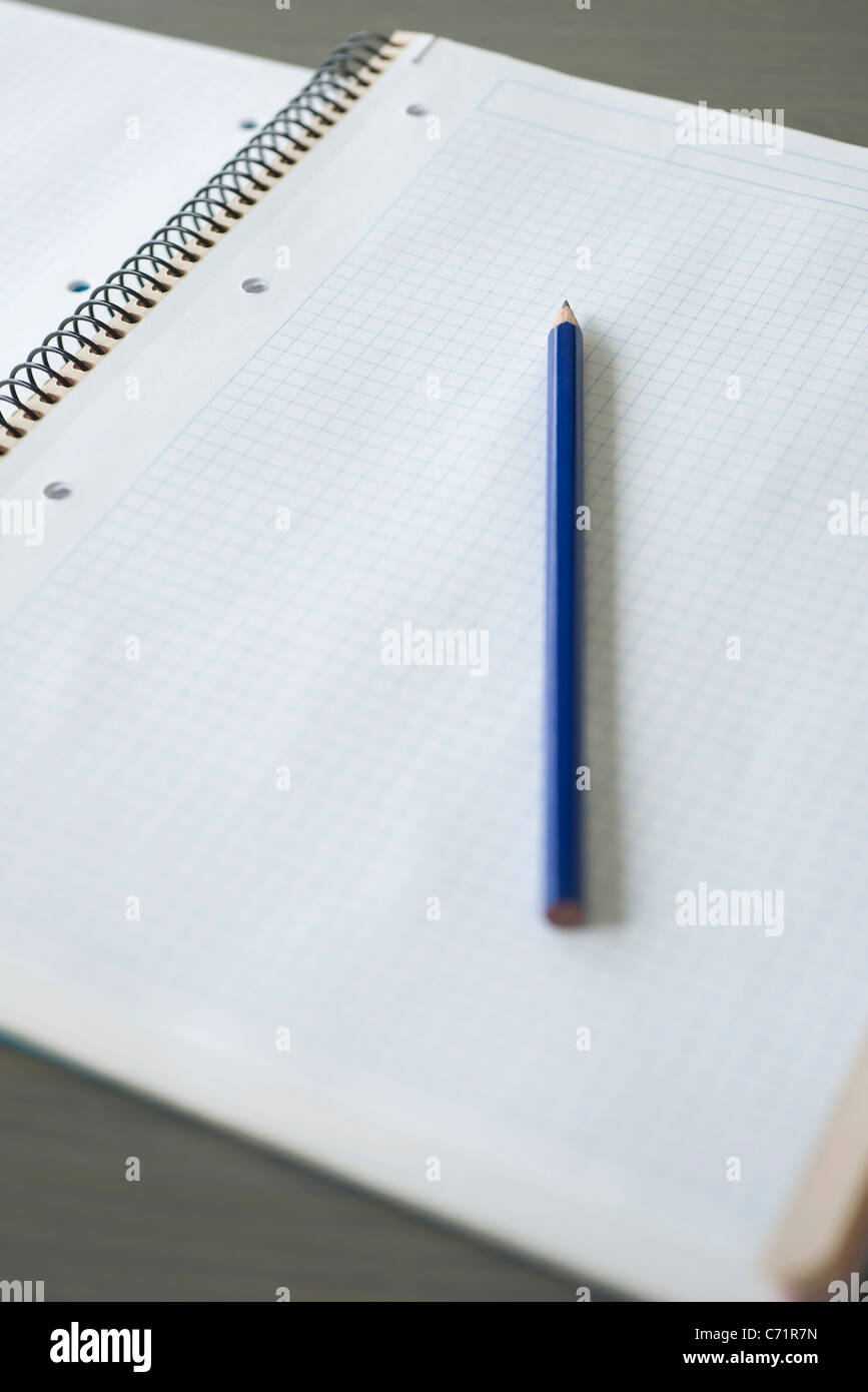 Spiral notebook and pencil Stock Photo - Alamy