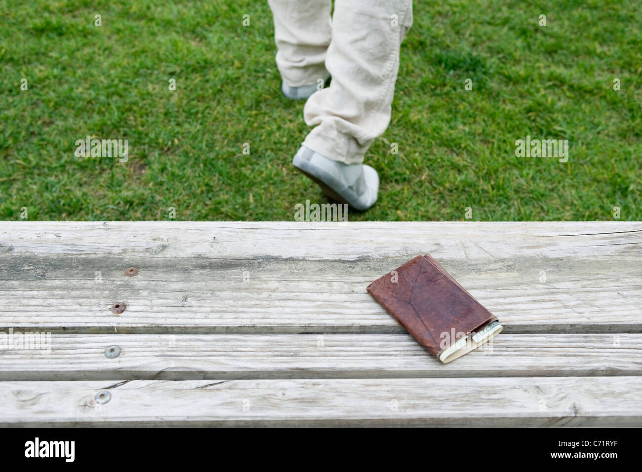 Wallet left on park bench Stock Photo - Alamy