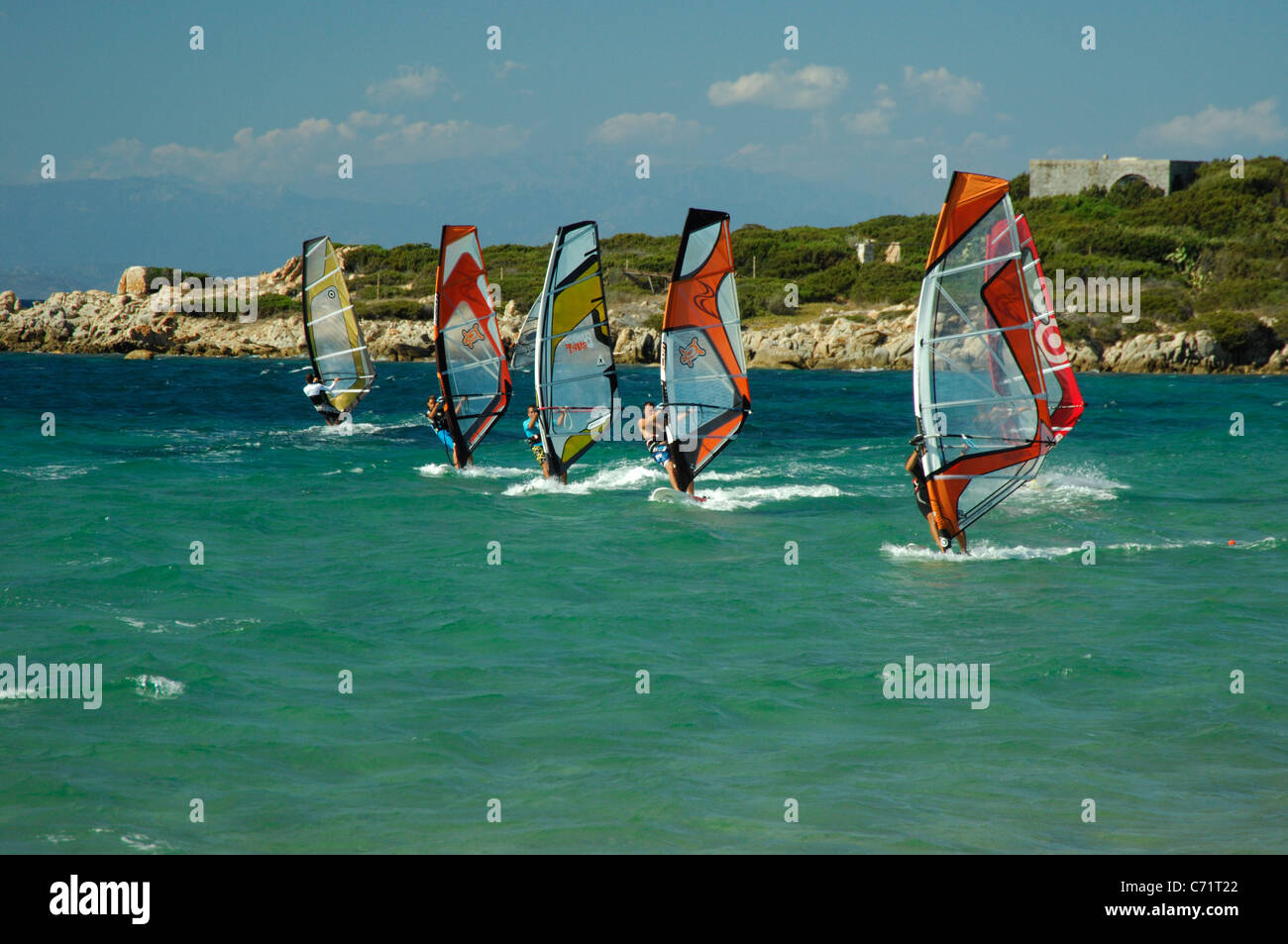 Windsurfs sailing at Porto Pollo bay,Palau, Sardinia Stock Photo - Alamy