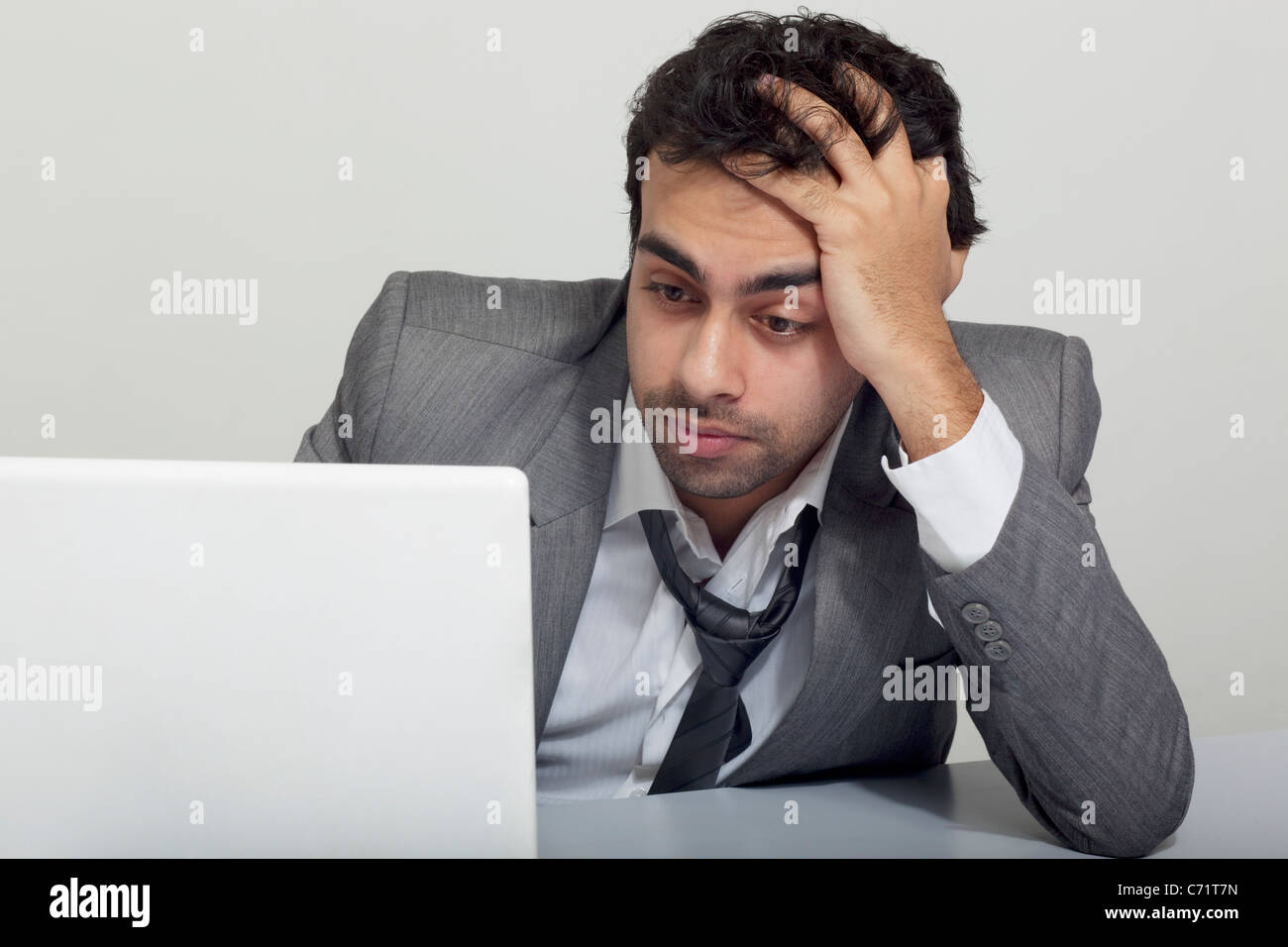 Businessman stressed at work Stock Photo - Alamy