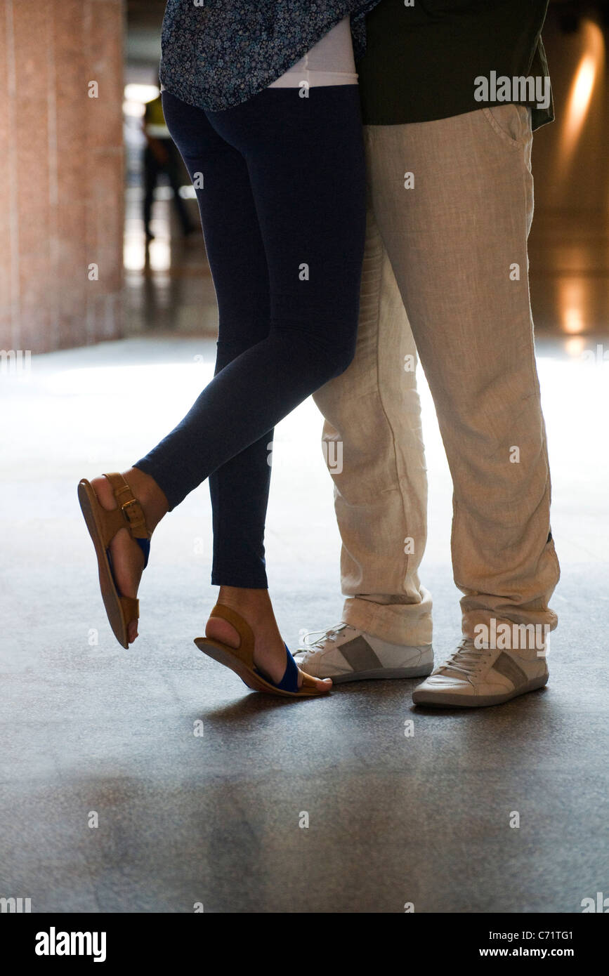 Couple standing close together, low section Stock Photo - Alamy