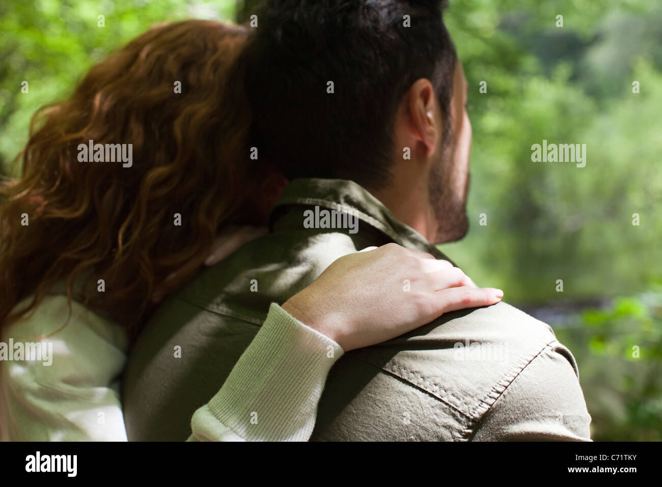 Couple mans arm around shoulder hi-res stock photography and images - Alamy