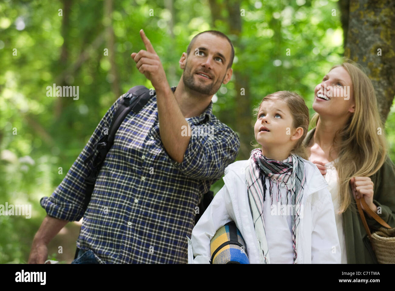 Family together outdoors, looking up in awe Stock Photo - Alamy