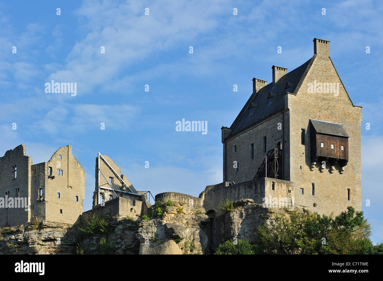 Ruins of the medieval Larochette Castle towering above the town ...