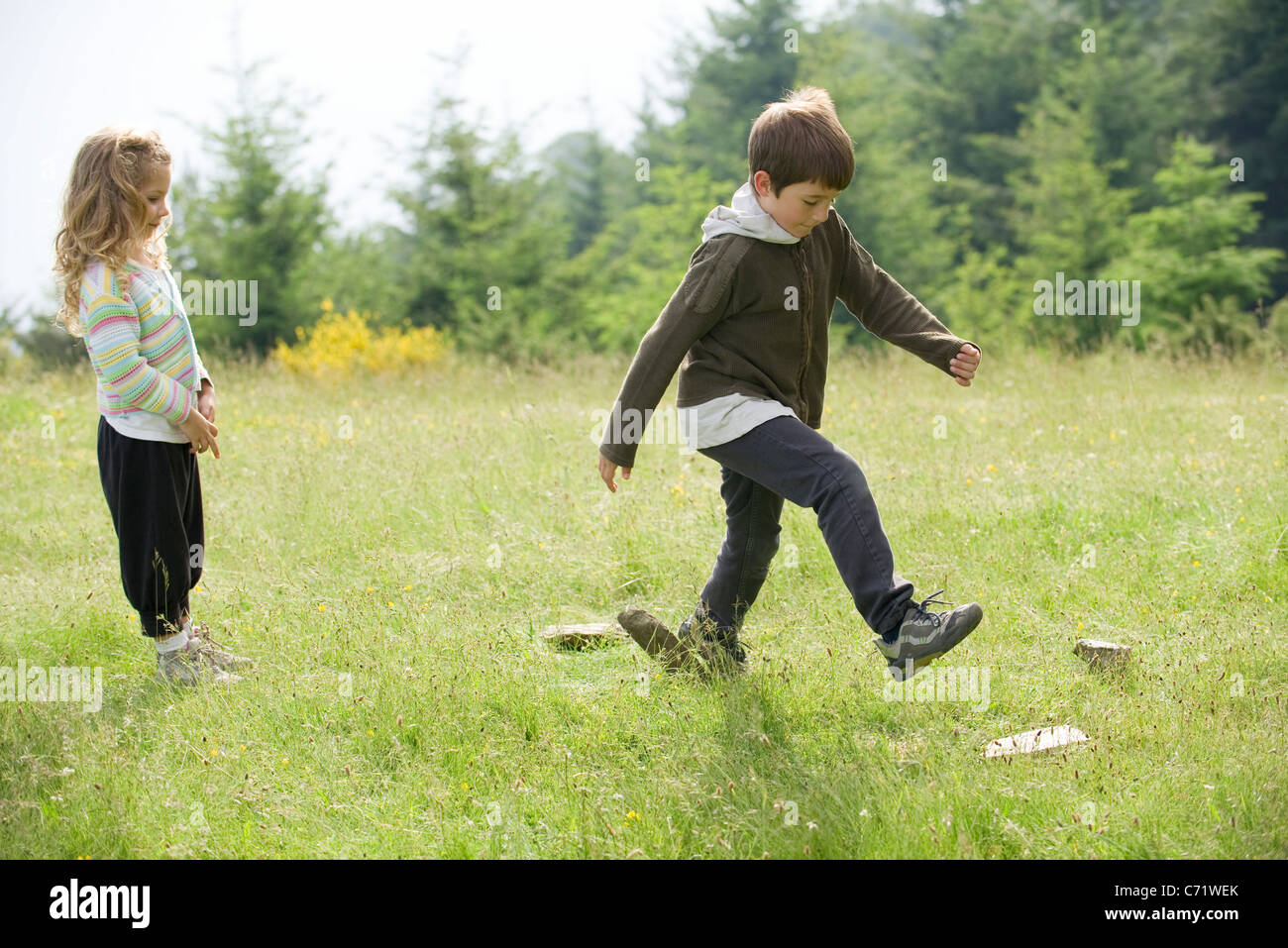 Children playing in field Stock Photo - Alamy