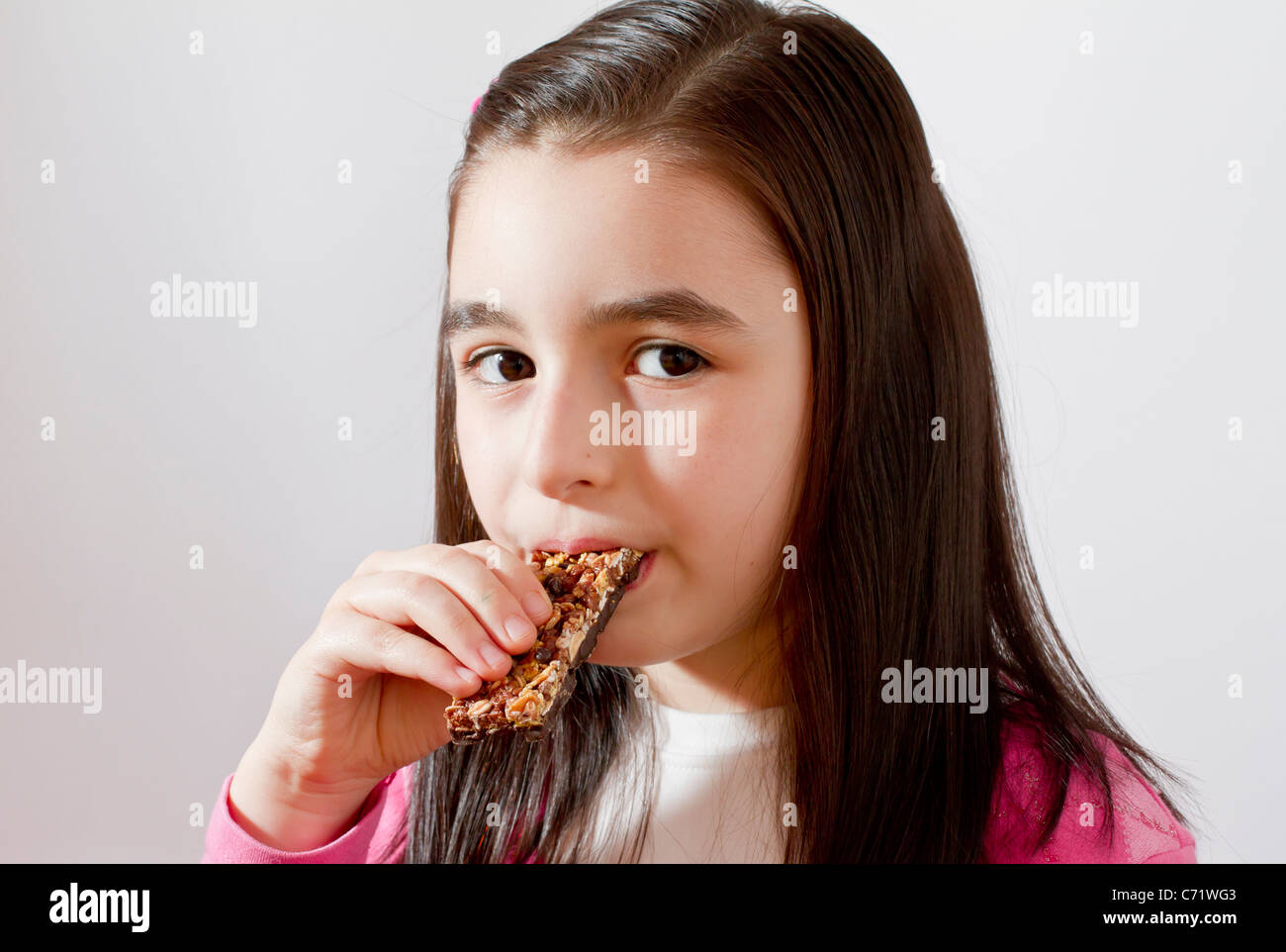 Child eating cereal bar hi-res stock photography and images - Alamy