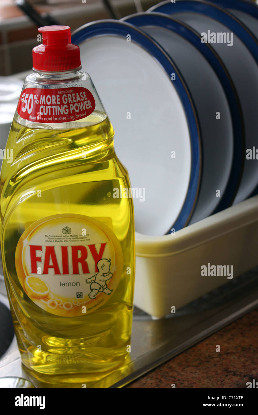Washing up on a draining board along with the fairy washing up liquid ...