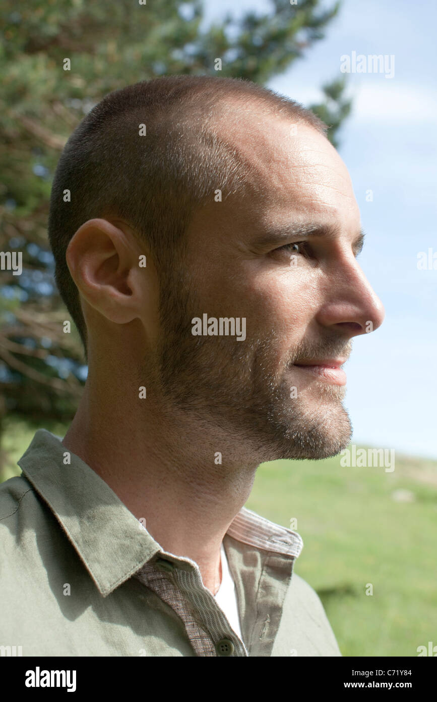Man in nature, portrait, profile Stock Photo - Alamy