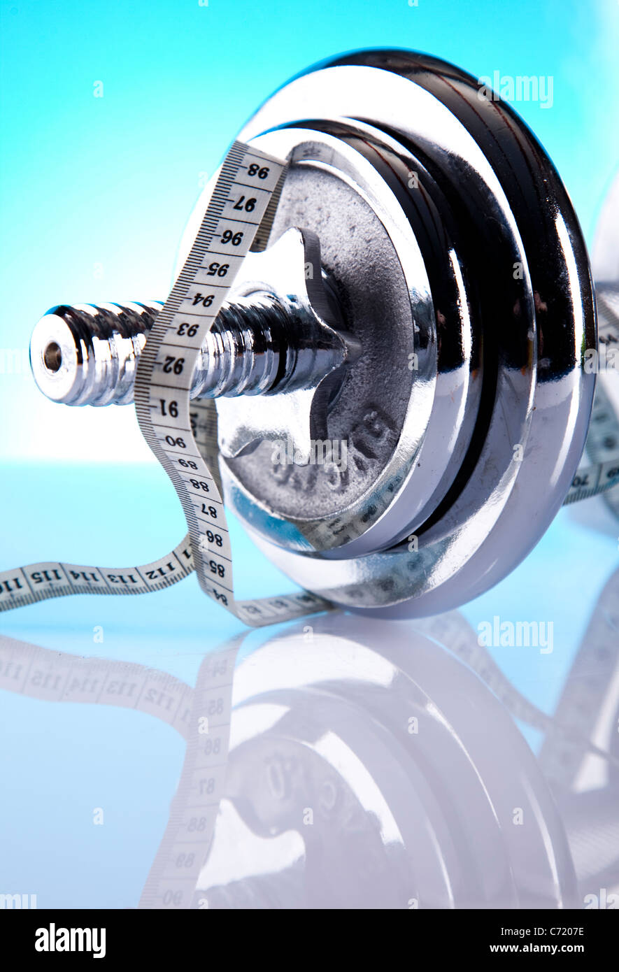 Measuring of dumbbell Stock Photo - Alamy