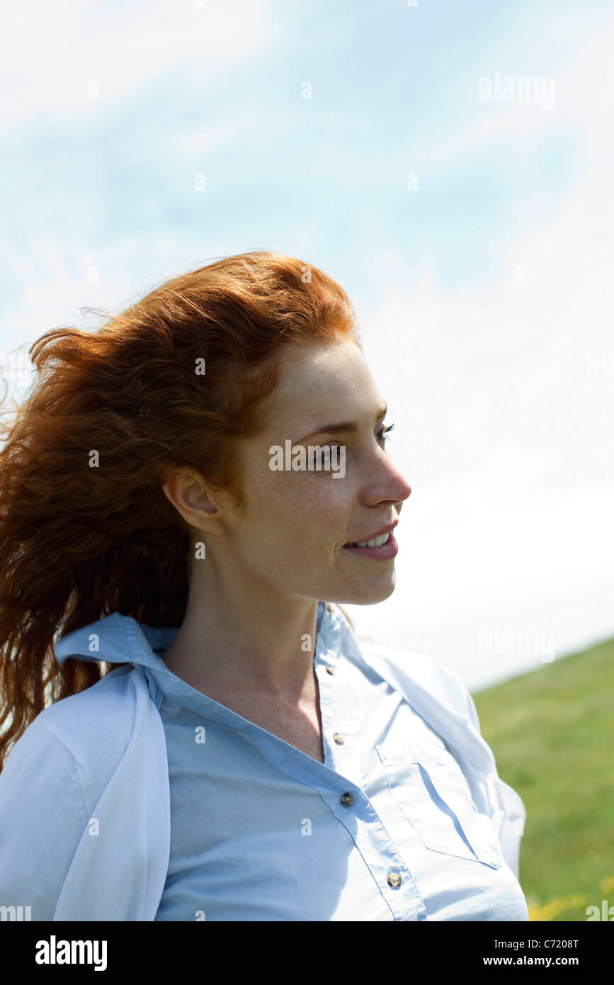 Redheaded woman in nature, portrait Stock Photo - Alamy