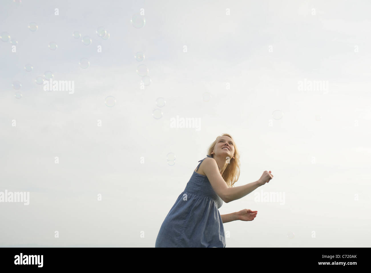 Happy floating bubble woman hi-res stock photography and images - Alamy