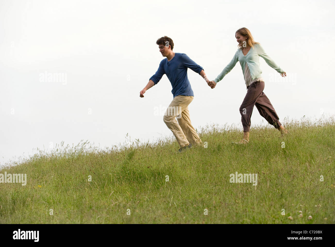 Couple Holding Hands Running