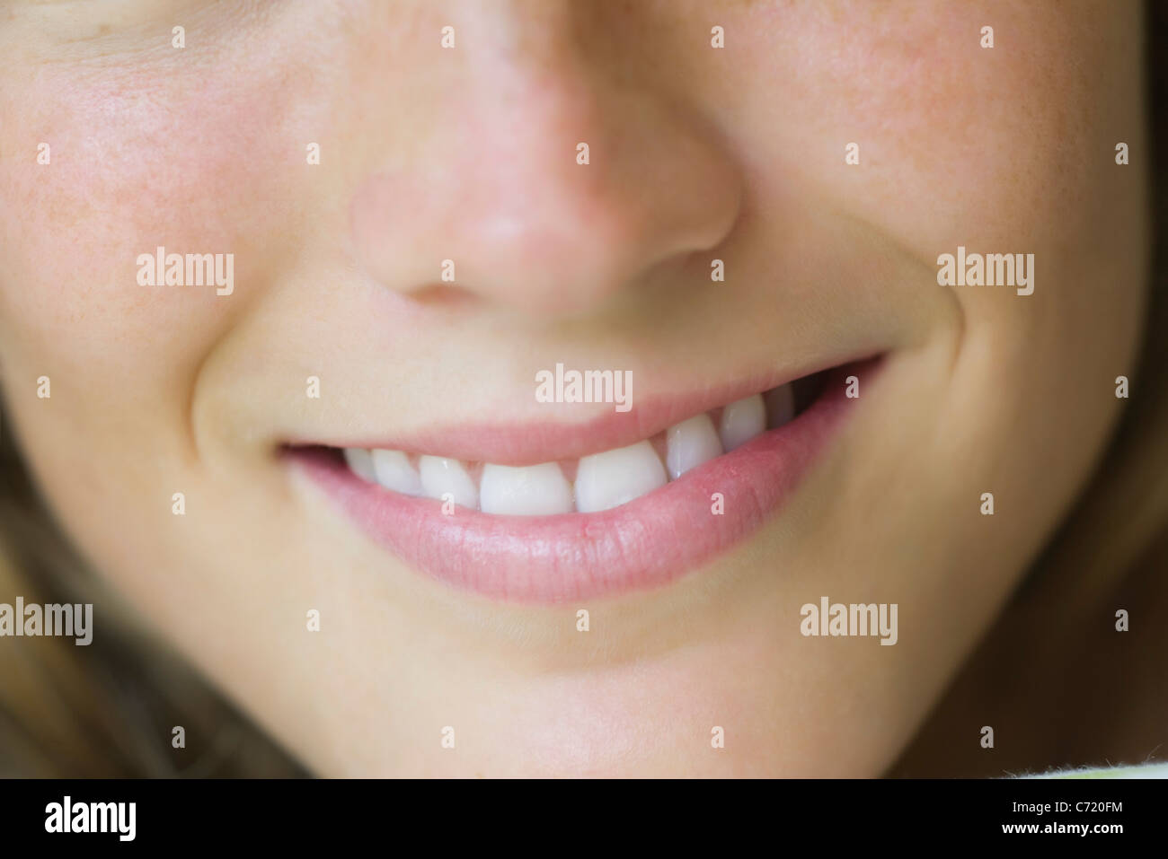 Close-up of young woman's smile Stock Photo - Alamy