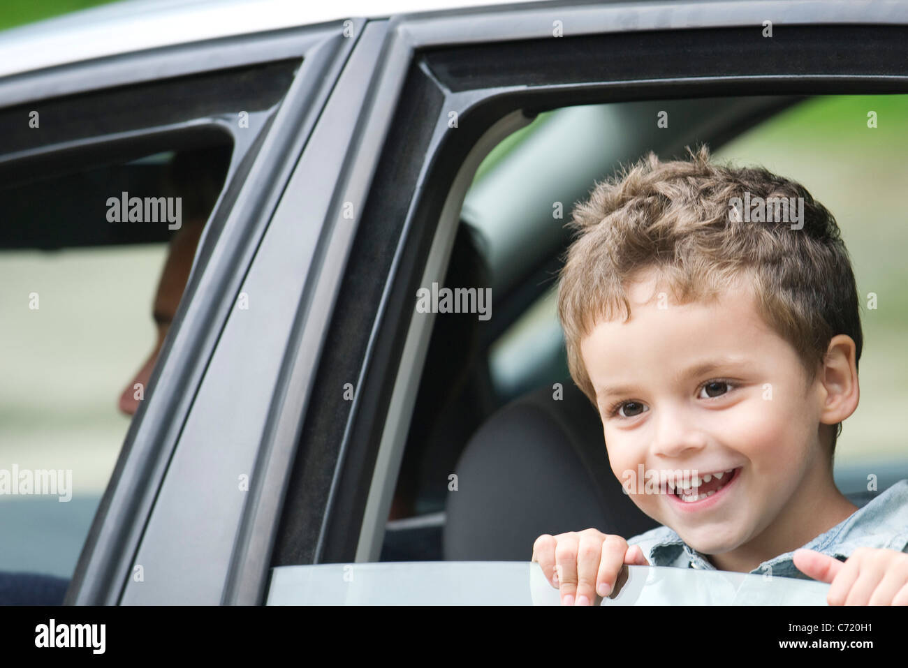 Little boy looking out car window, portrait Stock Photo - Alamy