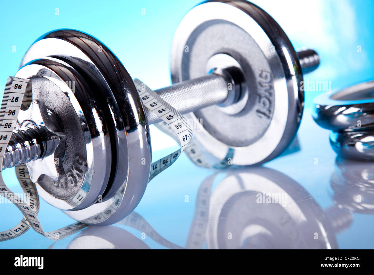 Measuring of dumbbell Stock Photo - Alamy