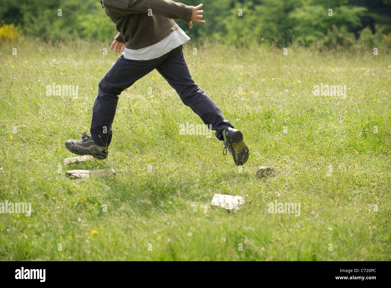 Boy running in field low hi-res stock photography and images - Alamy