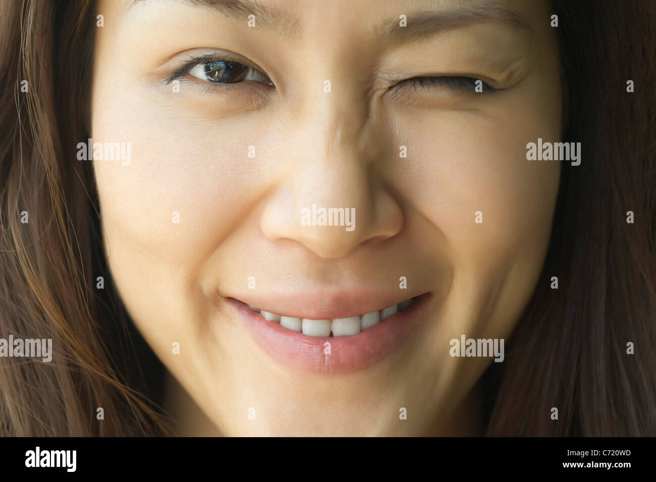 Asian woman winking hi-res stock photography and images - Alamy