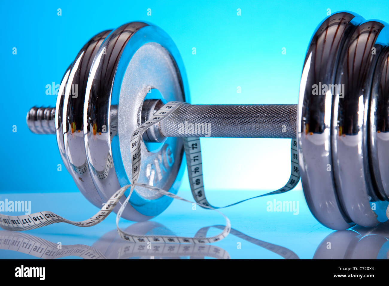 Measuring of dumbbell Stock Photo - Alamy