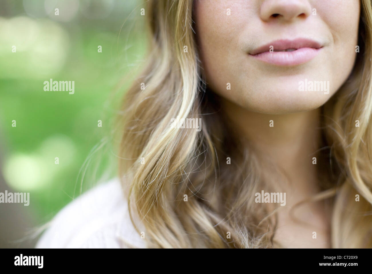 Young woman smiling, cropped Stock Photo - Alamy