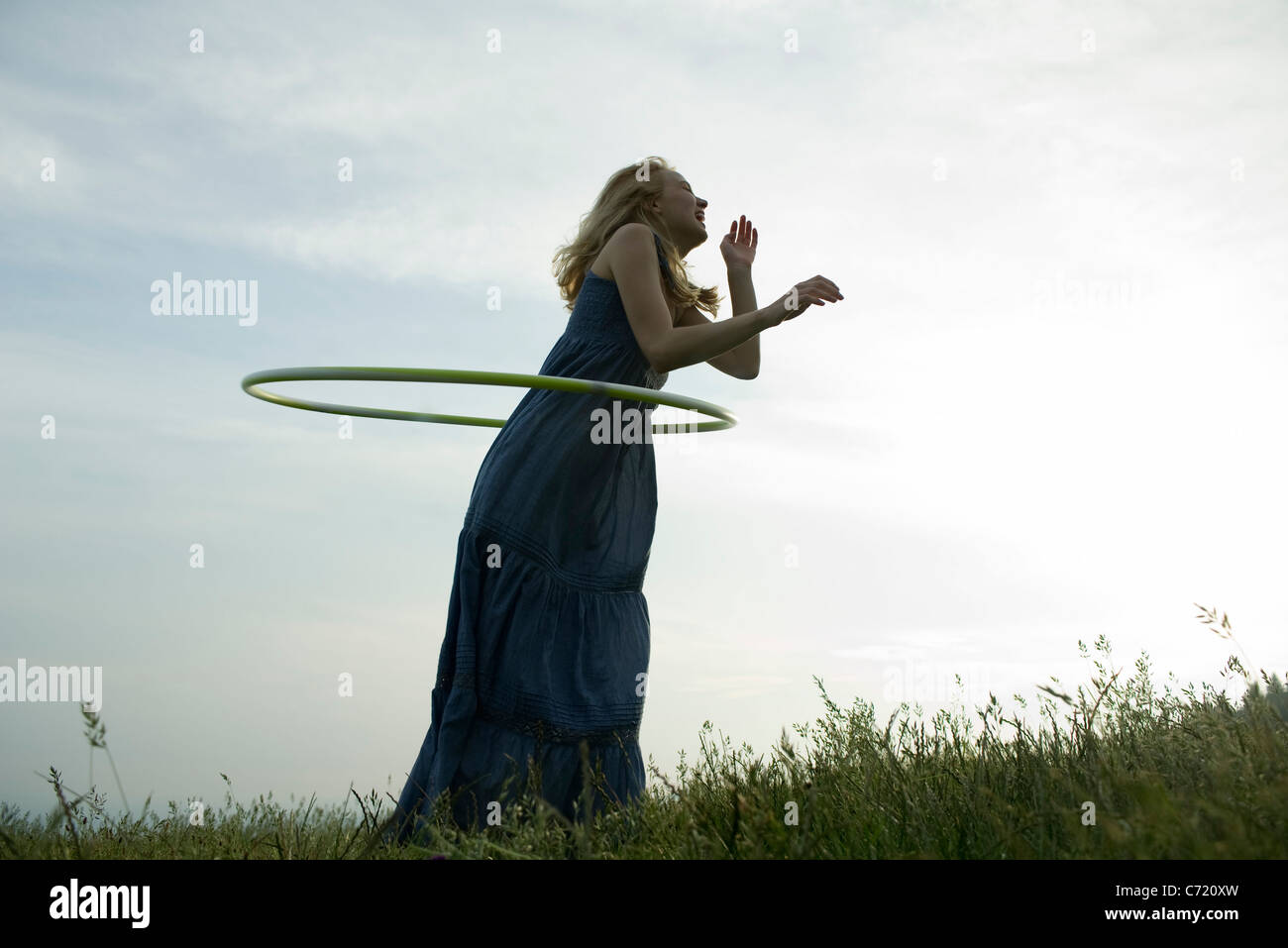 Hula hoop woman backlit hi-res stock photography and images - Alamy