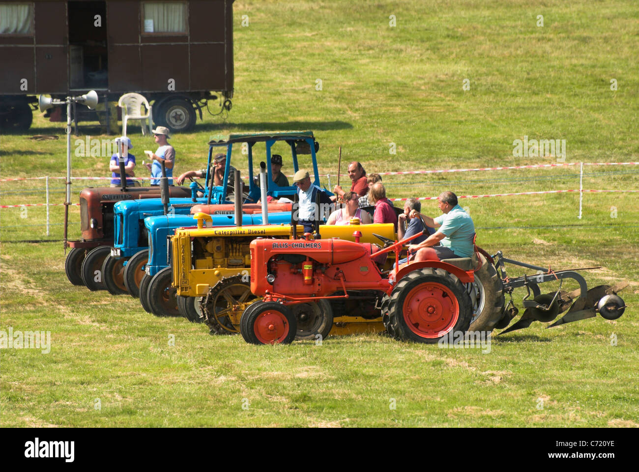 Farm tractors line up at the Wiston Park Steam Rally in West Sussex ...