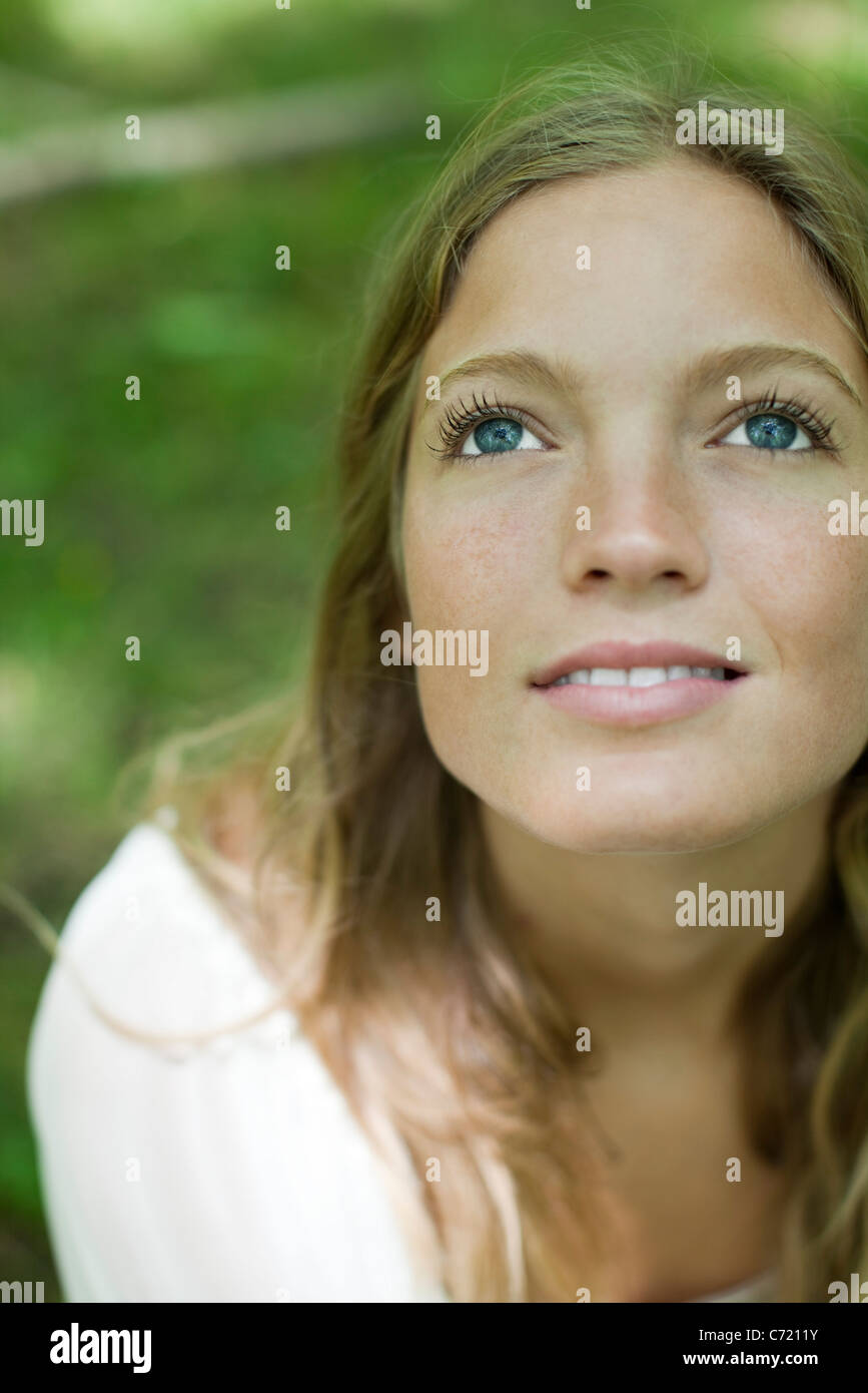Young woman looking up, portrait Stock Photo - Alamy