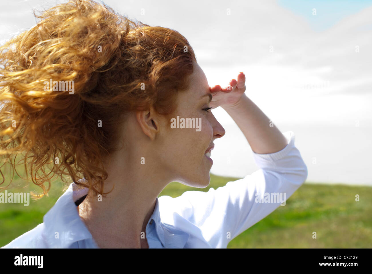Shading her eyes with hand hi-res stock photography and images - Alamy