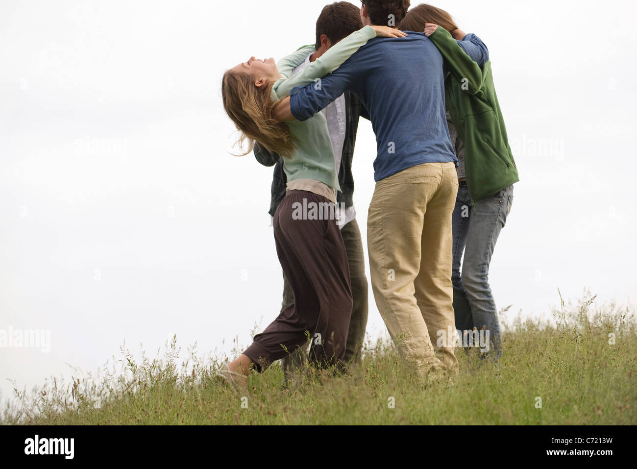 Friends gathering around in circle Stock Photo - Alamy
