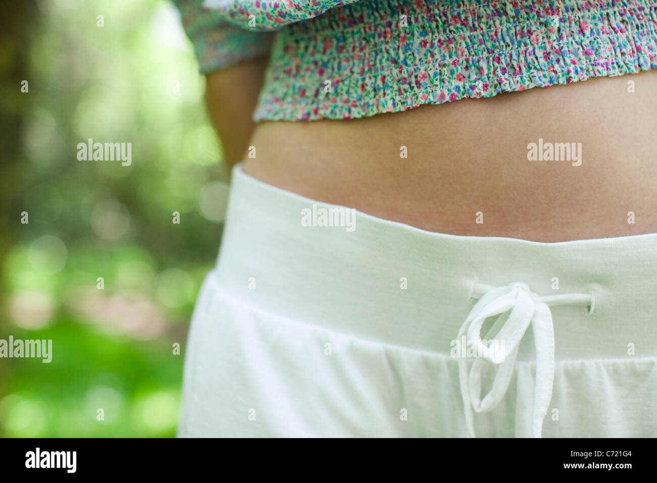 Young woman's abdomen, mid section Stock Photo - Alamy