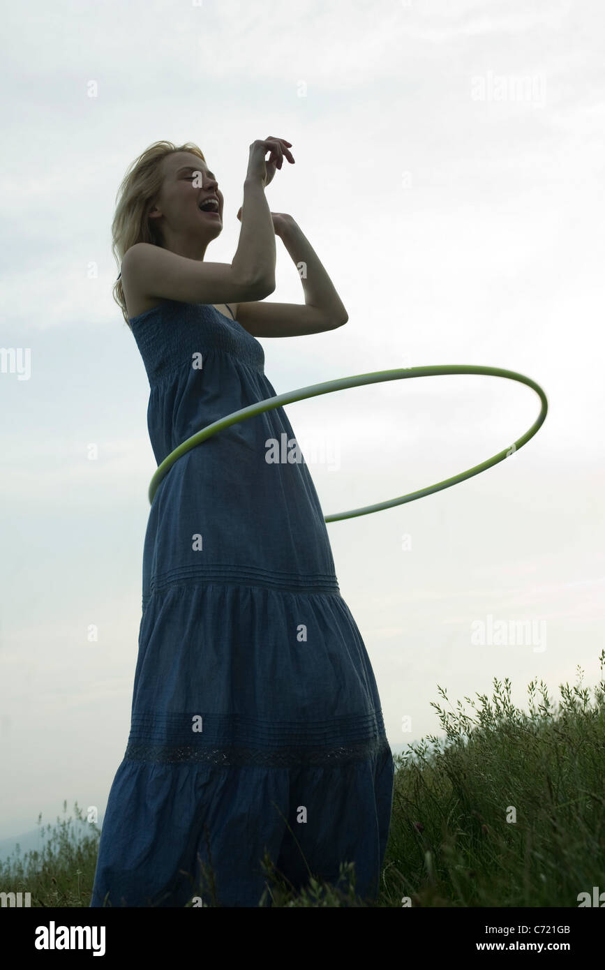 Hula hoop woman backlit hi-res stock photography and images - Alamy