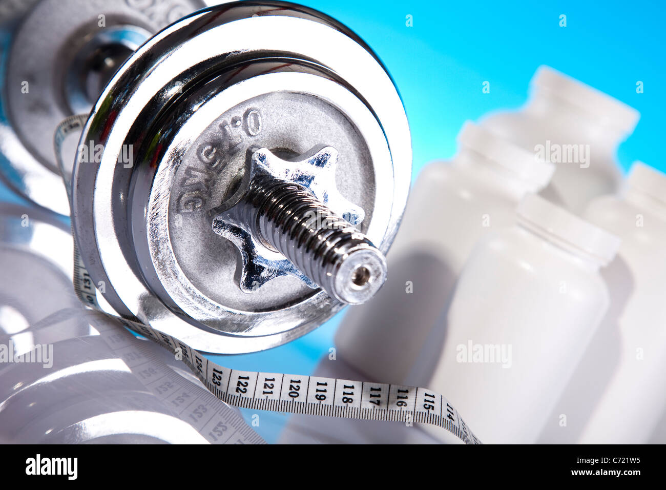 Measuring of dumbbell Stock Photo - Alamy