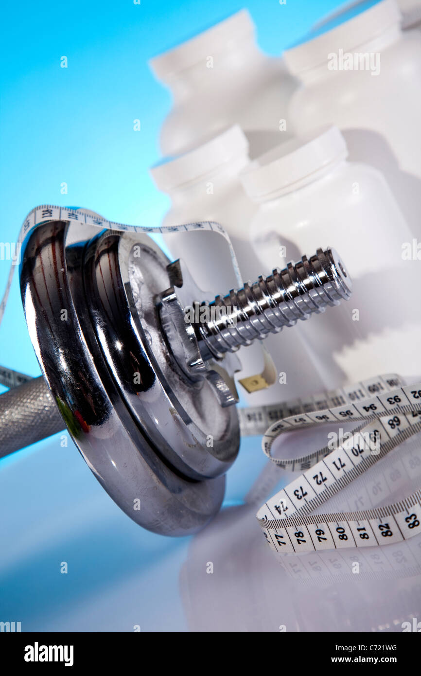 Measuring of dumbbell Stock Photo - Alamy