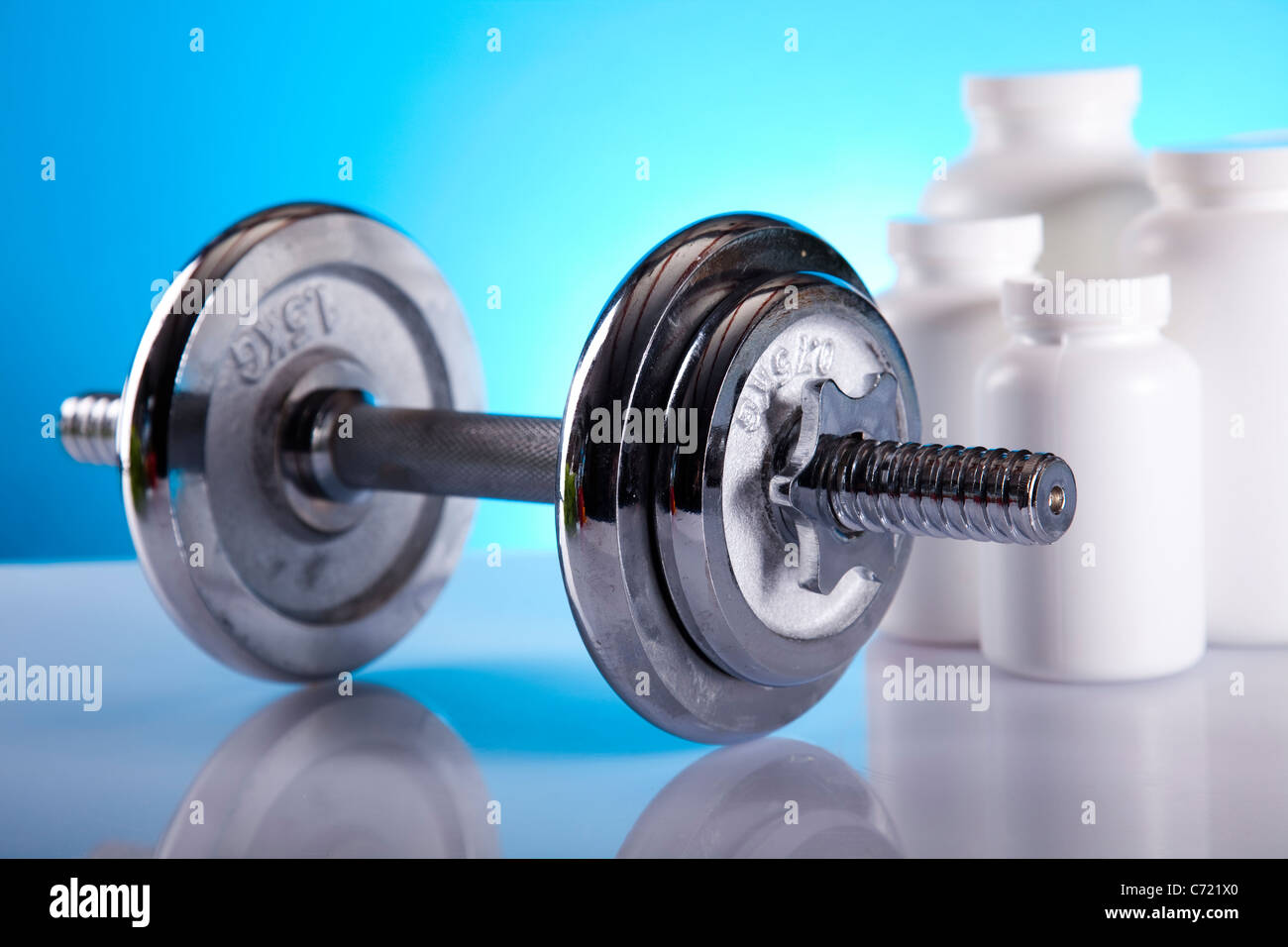 Measuring of dumbbell Stock Photo - Alamy