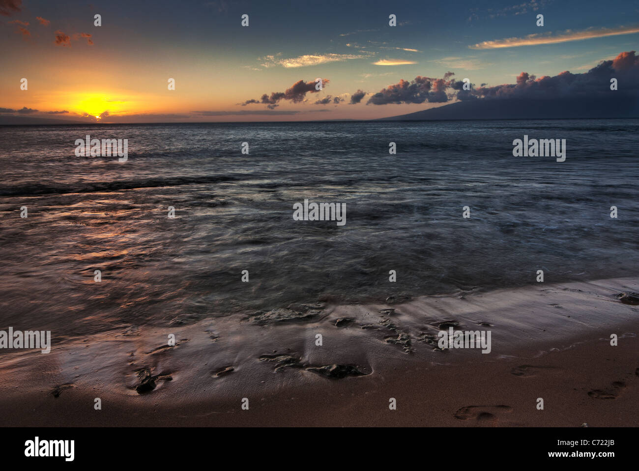 Sunset on a beach on Kaanapali Maui Hawaii showing the colorful sky ...