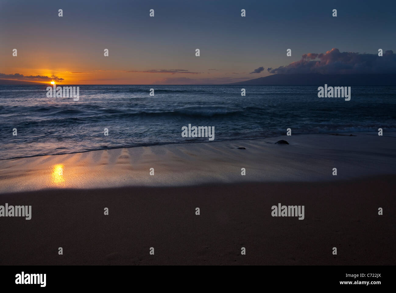 Sunset over a Maui beach Stock Photo - Alamy