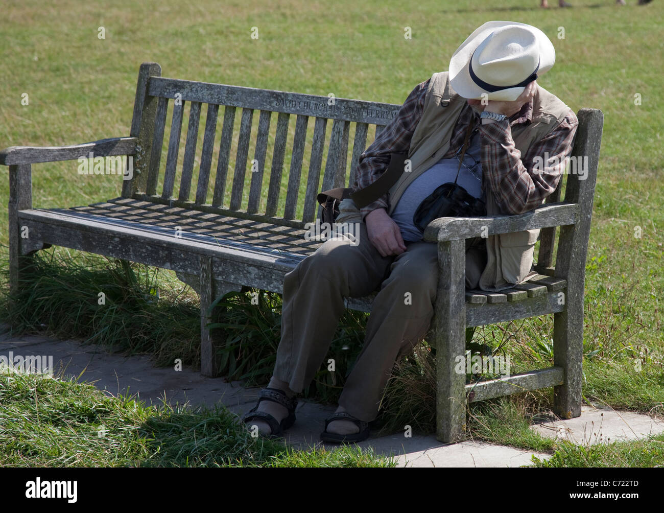 Asleep on a bench Stock Photo - Alamy