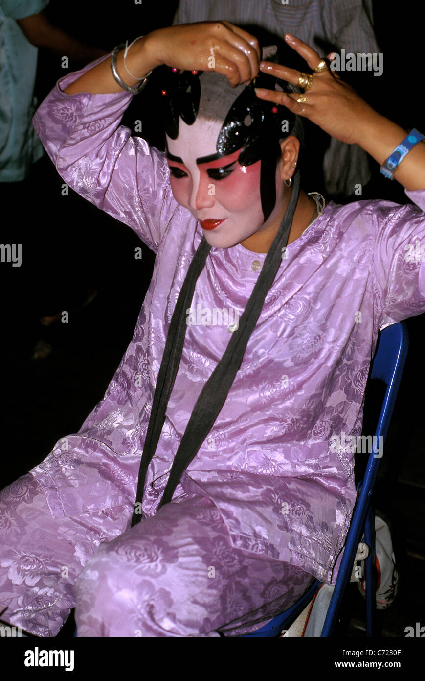 Chinese opera artiste prepares for a performance in George Town, Penang ...