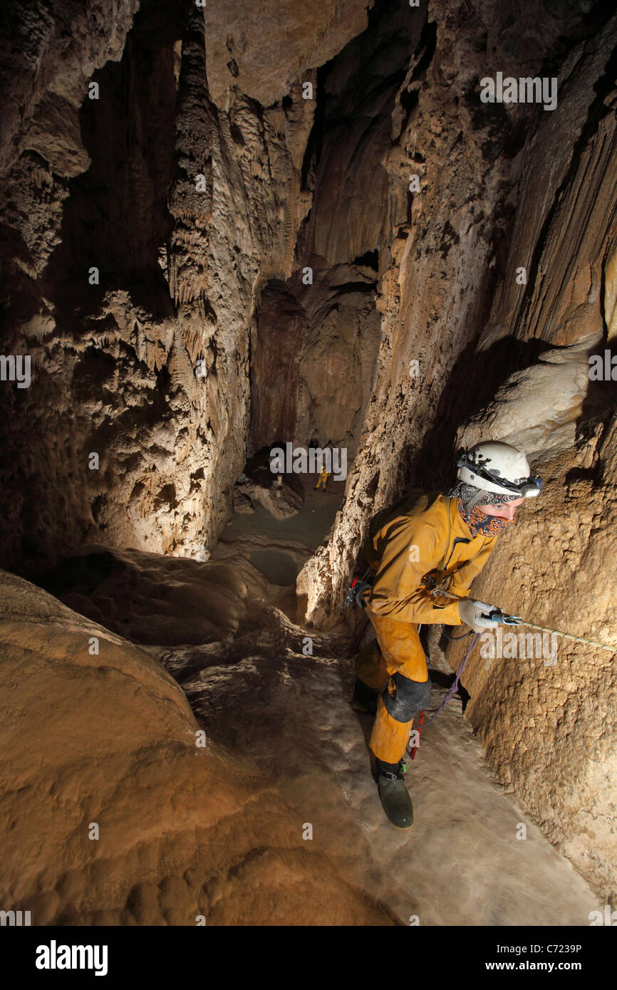 Explorer with torch in cave hi-res stock photography and images - Alamy