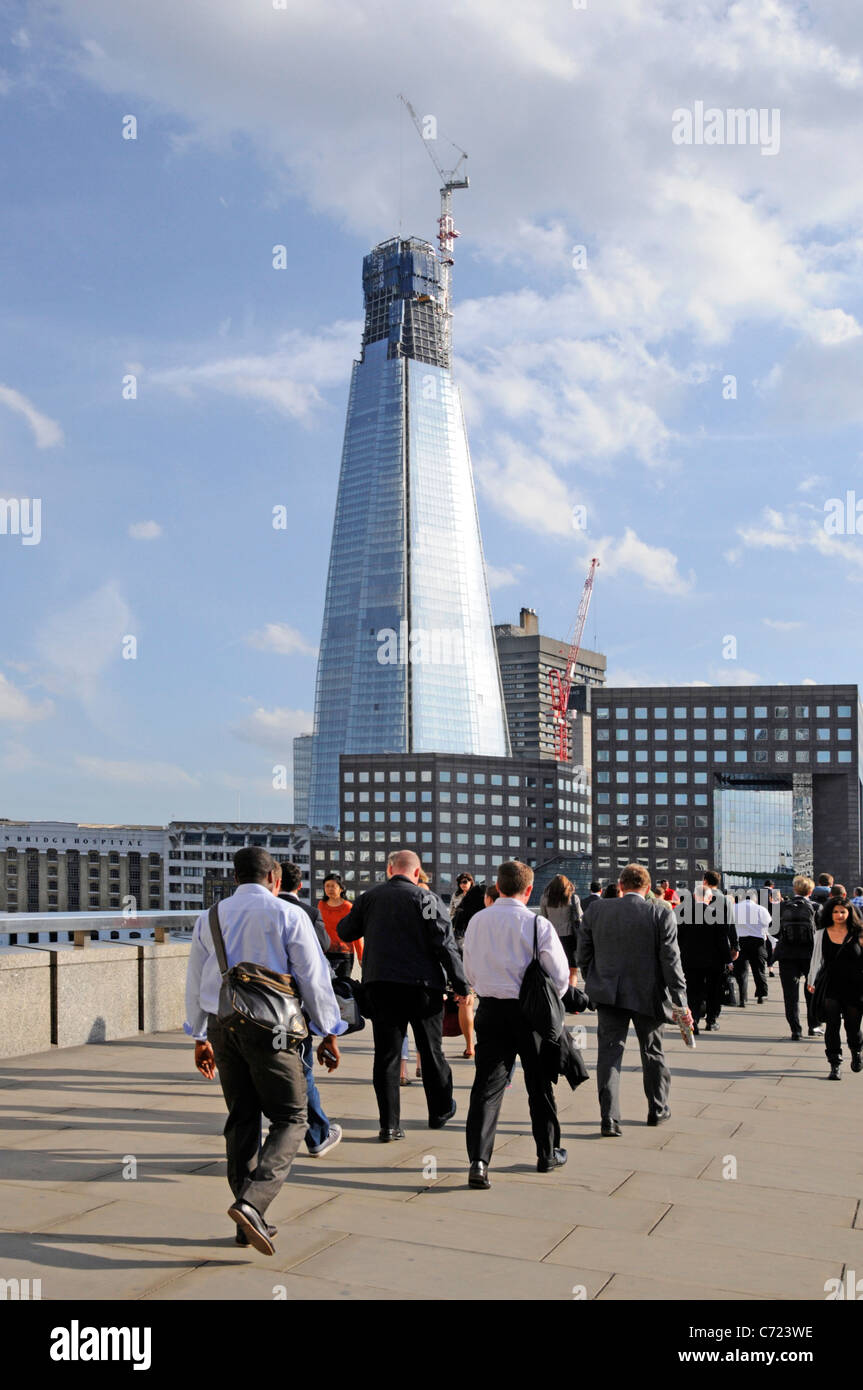 London Bridge and the Shard building with office workers walking ...