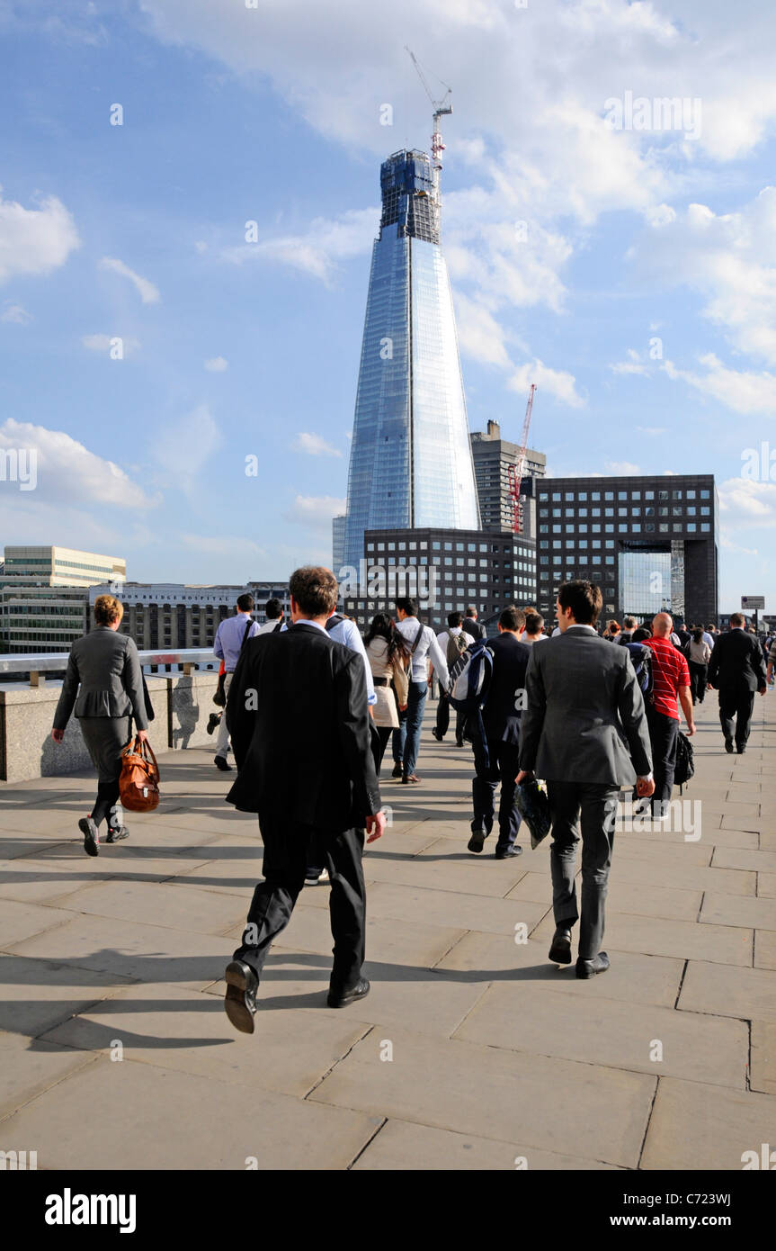 London Bridge and the Shard building with office workers walking ...