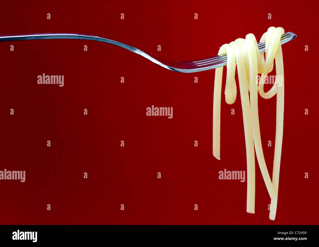 Spaghetti twirled round a fork Stock Photo - Alamy