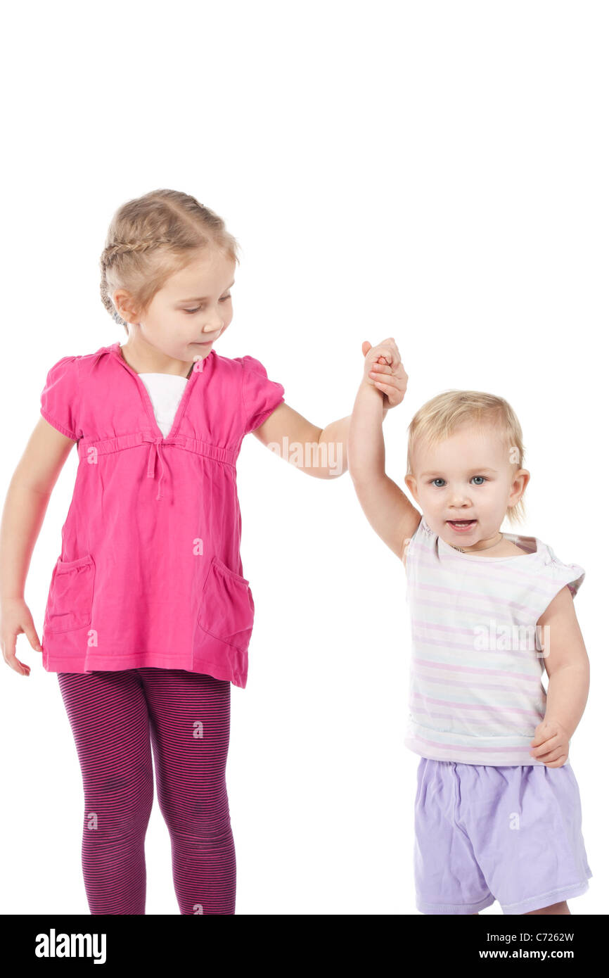 Beautiful girls playing isolated on white Stock Photo - Alamy