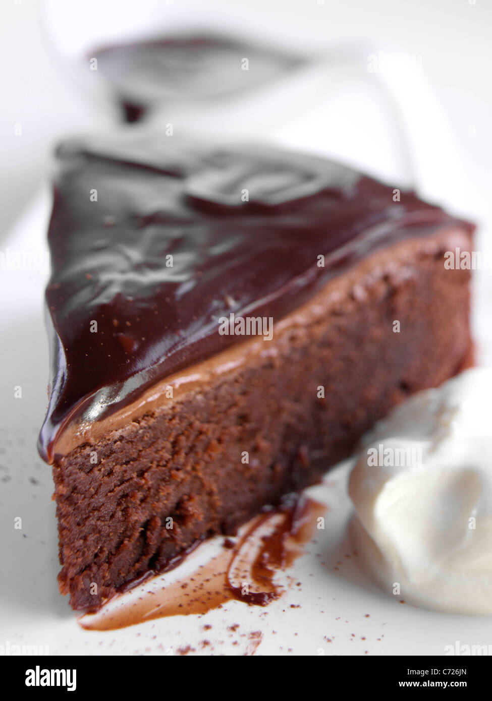 Chocolate fudge cake slice Stock Photo - Alamy