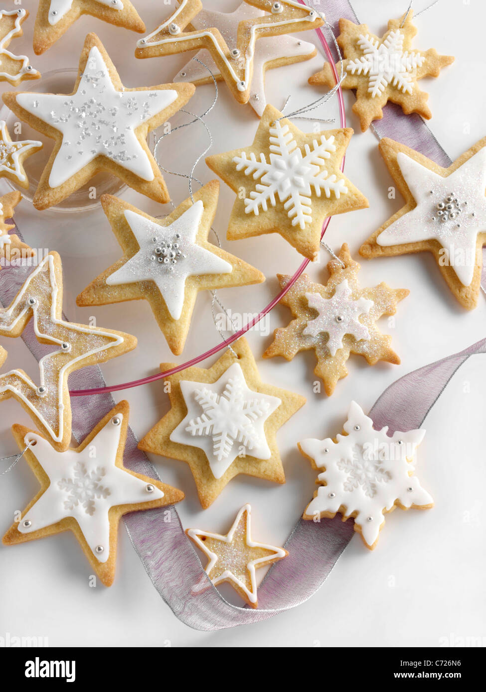 Star shaped iced Christmas biscuits Stock Photo - Alamy