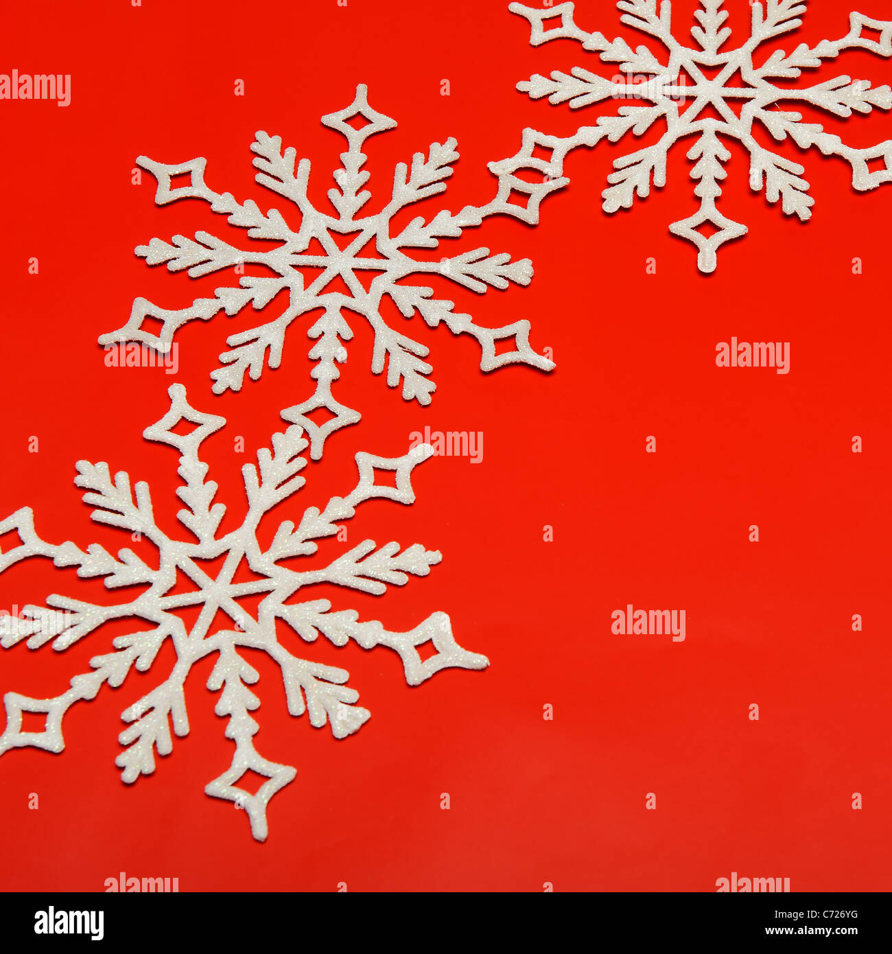 The big snowflake on a red background. Closeup Stock Photo - Alamy